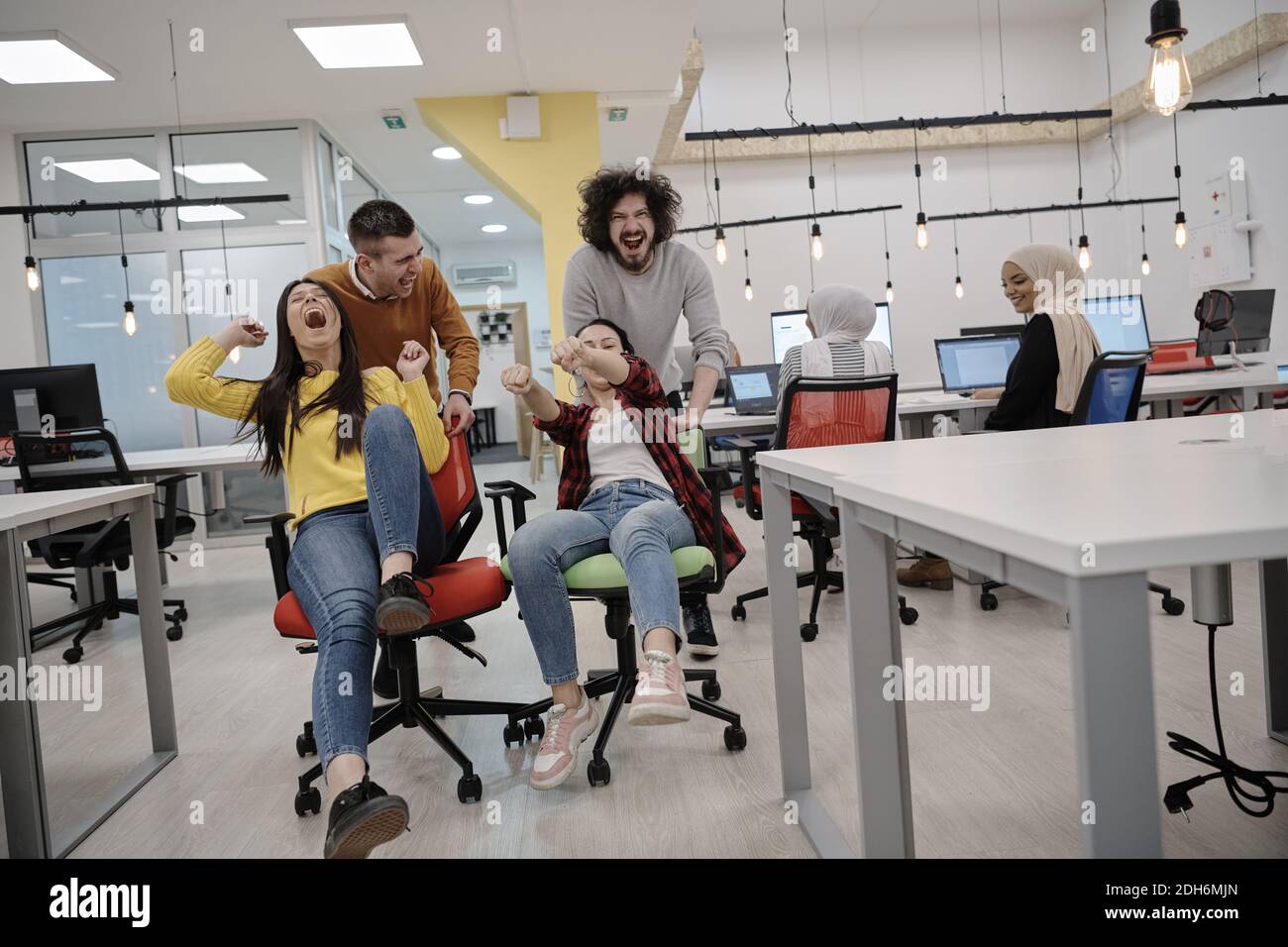 Racing on office chairs Stock Photo - Alamy