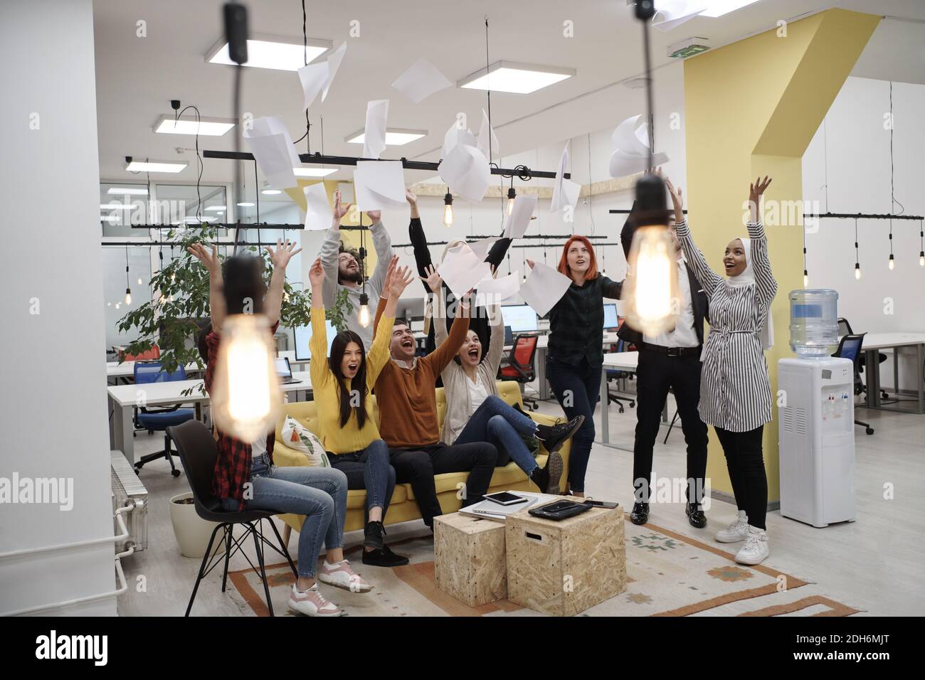 Business people throwing paper in air Stock Photo - Alamy