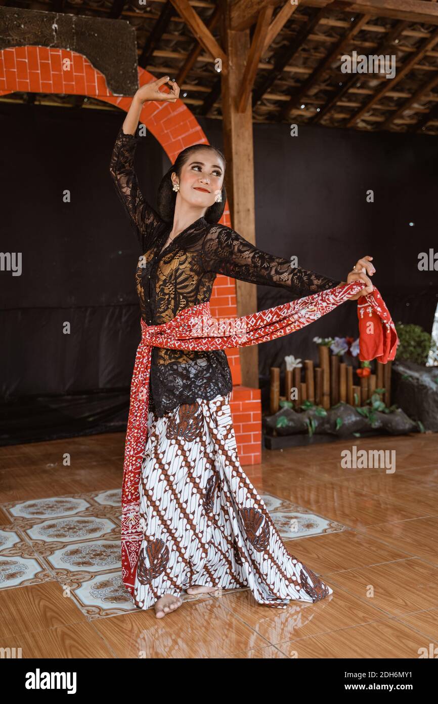 portrait young women presenting traditional Javanese dance movements ...