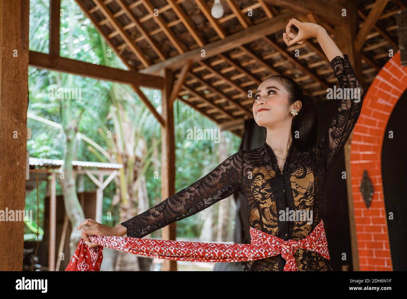 portrait young women presenting traditional Javanese dance movements ...