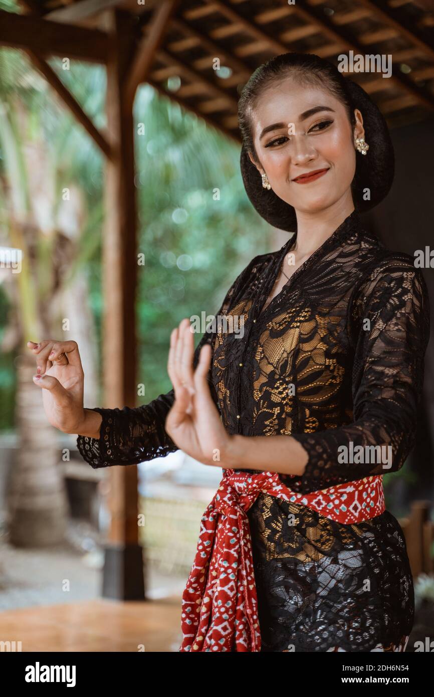 portrait young women presenting traditional Javanese dance movements ...