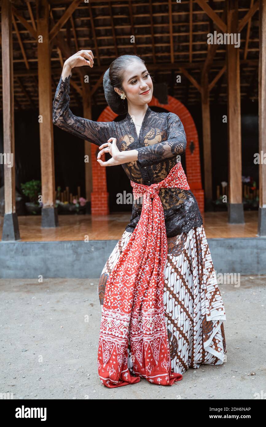 portrait young women presenting traditional Javanese dance movements ...