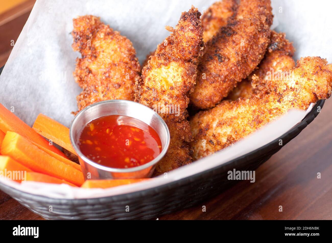chicken tenders or strips with a spicy chilli sauce and vegetable ...