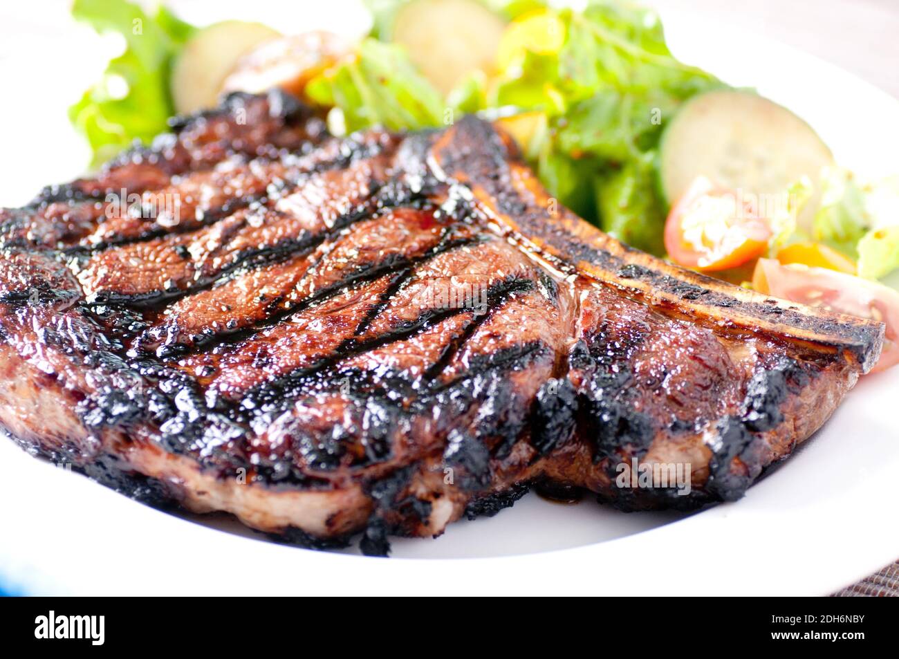 a rare rib steak cooked to perfection on the grill Stock Photo - Alamy