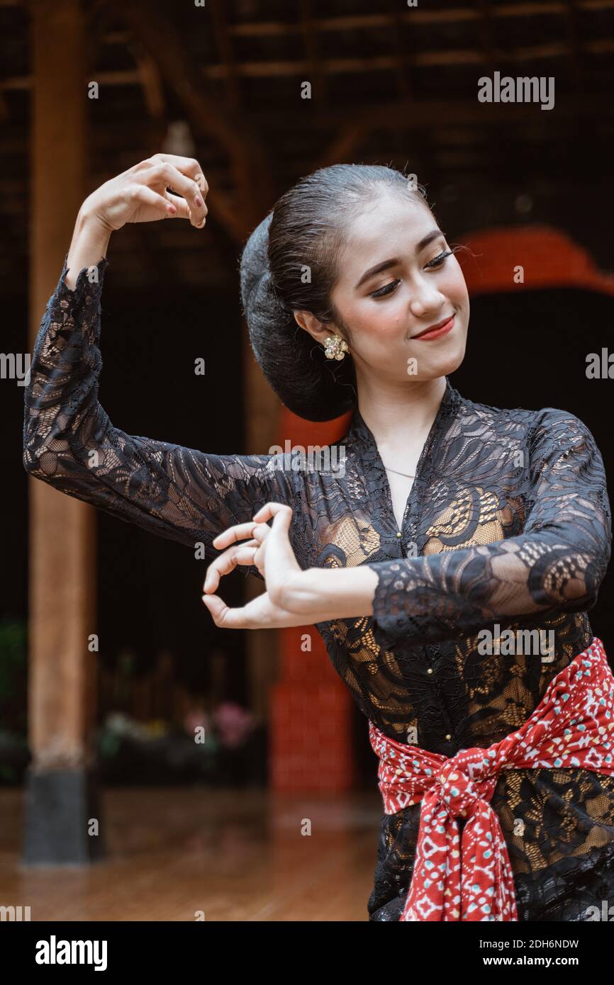 portrait young women presenting traditional Javanese dance movements ...