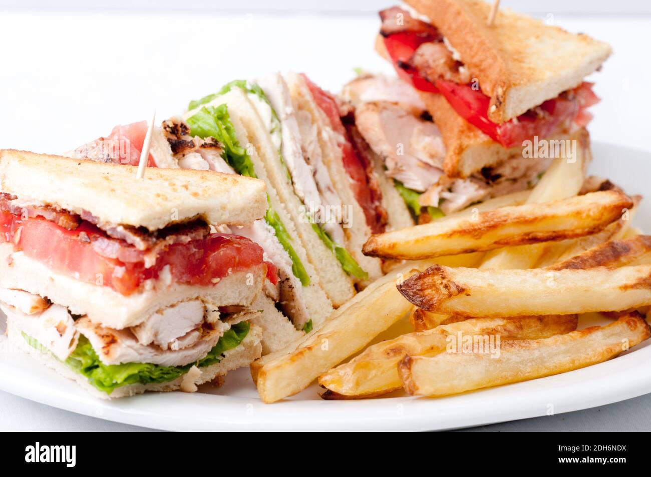 clubhouse sandwich on organic seed bread with crispy fries Stock Photo ...