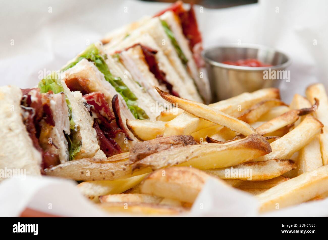clubhouse sandwich with french fries Stock Photo - Alamy