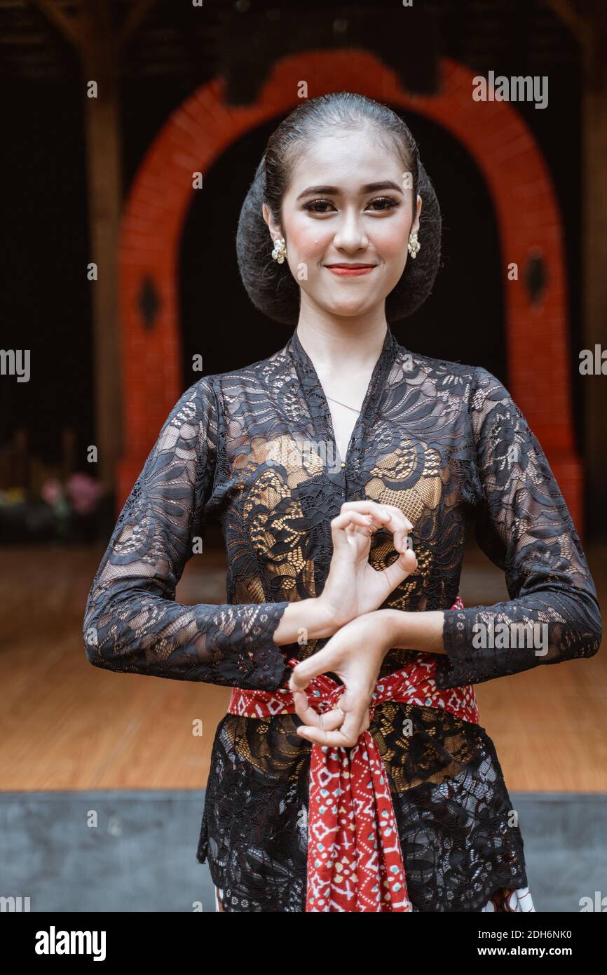 portrait young women presenting traditional Javanese dance movements ...