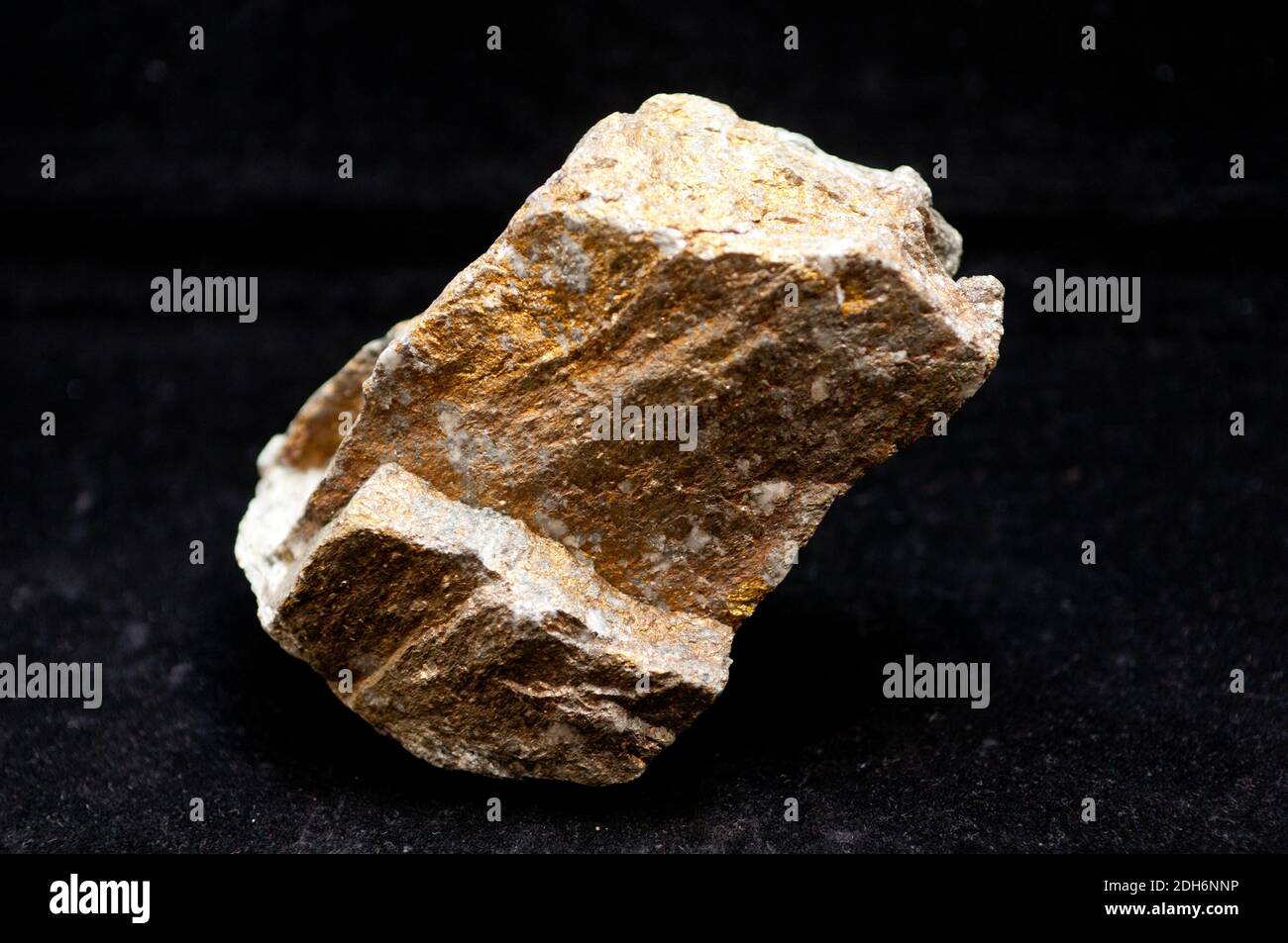 chalcopyrite rare earth mineral sample on a black background Stock ...