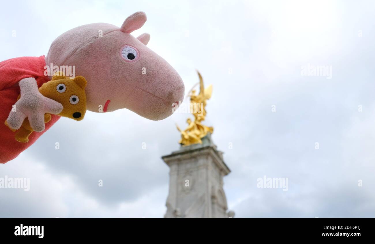 Peppa Pig doll looking at Ornate Queen Victoria Memorial in front of ...