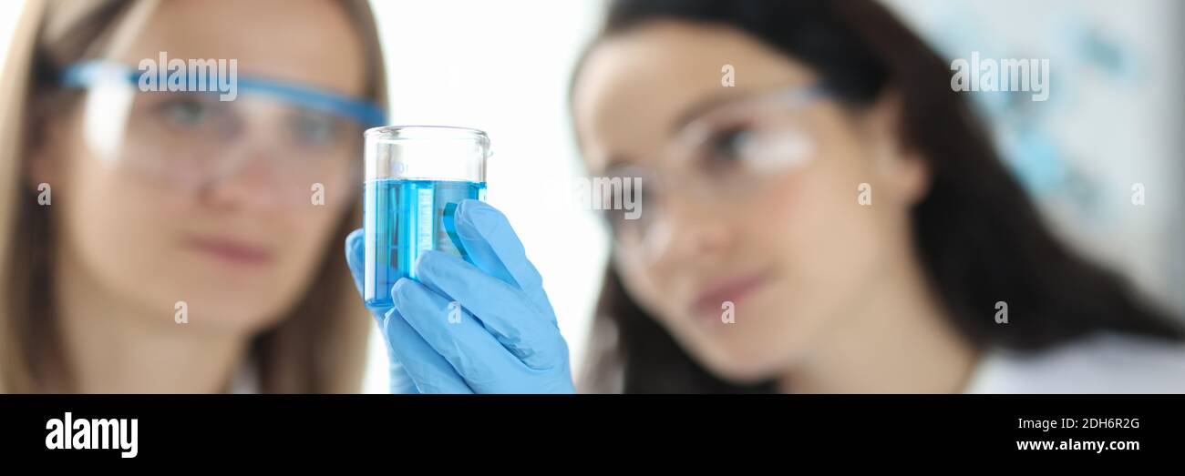Two scientists are conducting experiments in laboratory Stock Photo - Alamy