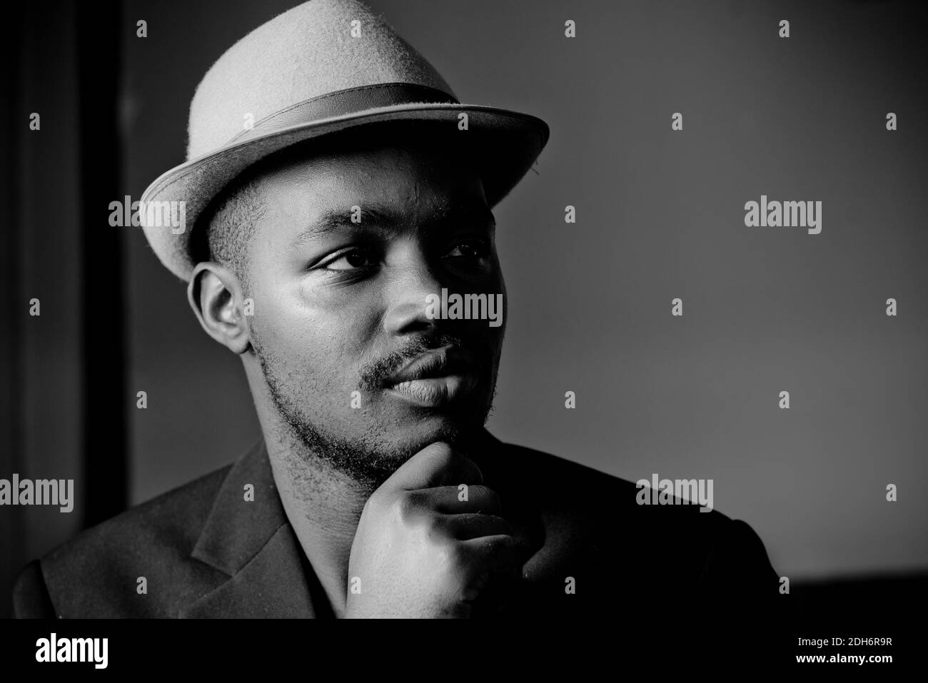 Vintage african man mafia model in black suit. B&W style style Stock ...