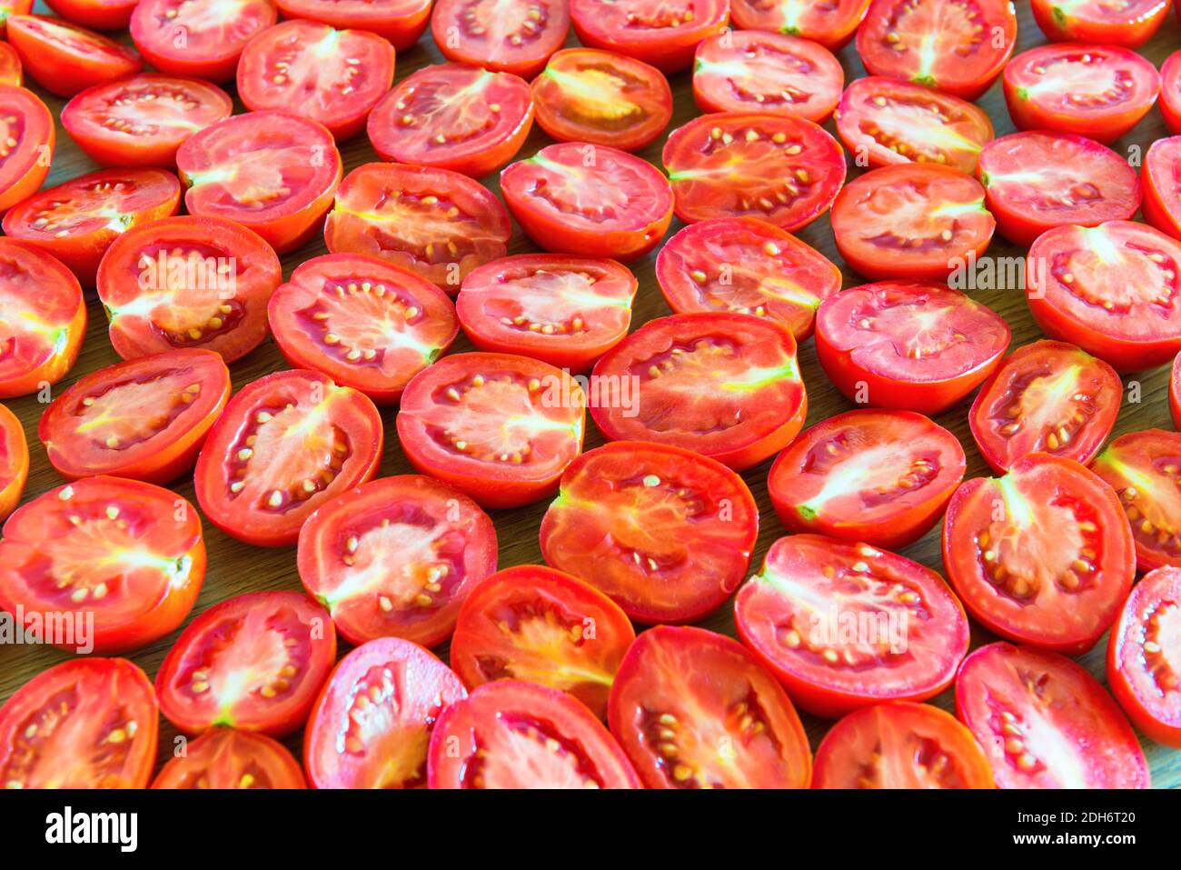 Red half sliced tomato Stock Photo - Alamy