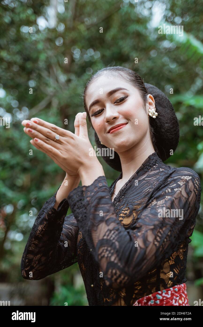 portrait young women presenting traditional Javanese dance movements ...