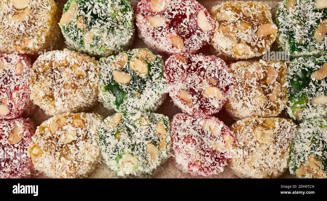 Sweet Turkish delight in coconut white shavings, dessert lies in rows ...