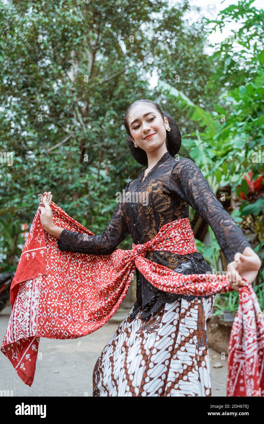 portrait young women presenting traditional Javanese dance movements ...