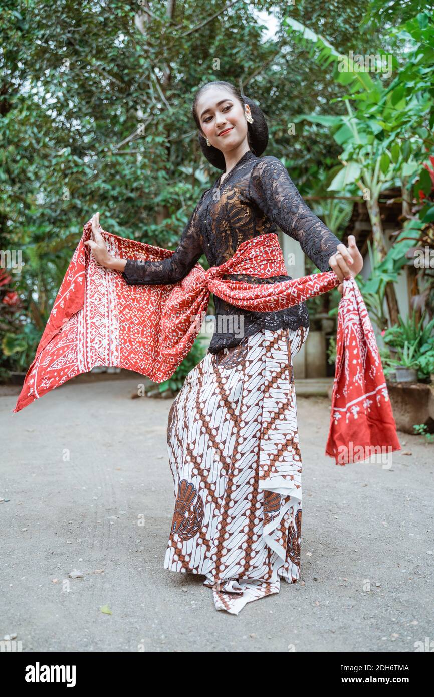 portrait young women presenting traditional Javanese dance movements ...