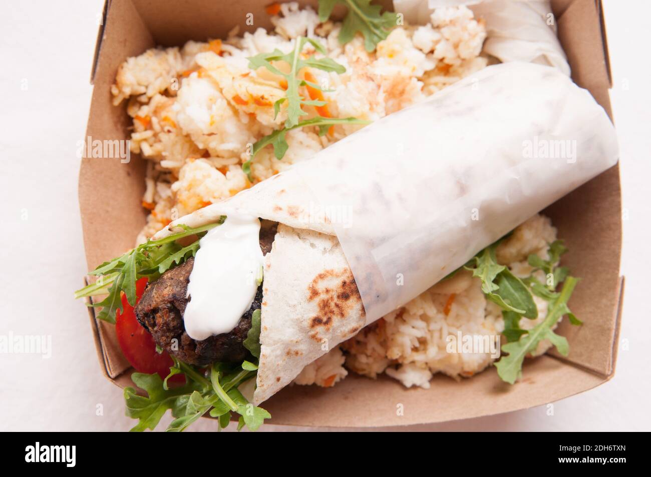 lamb wrap with home made pita and sweet rice Stock Photo - Alamy