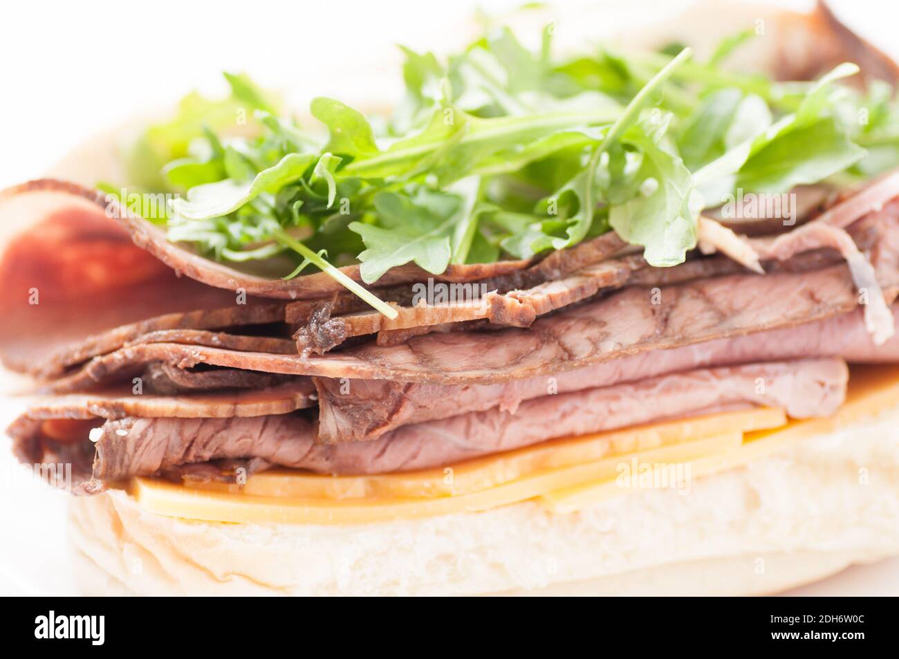 rare roast beef on a submarine bun with cheddar cheese Stock Photo - Alamy