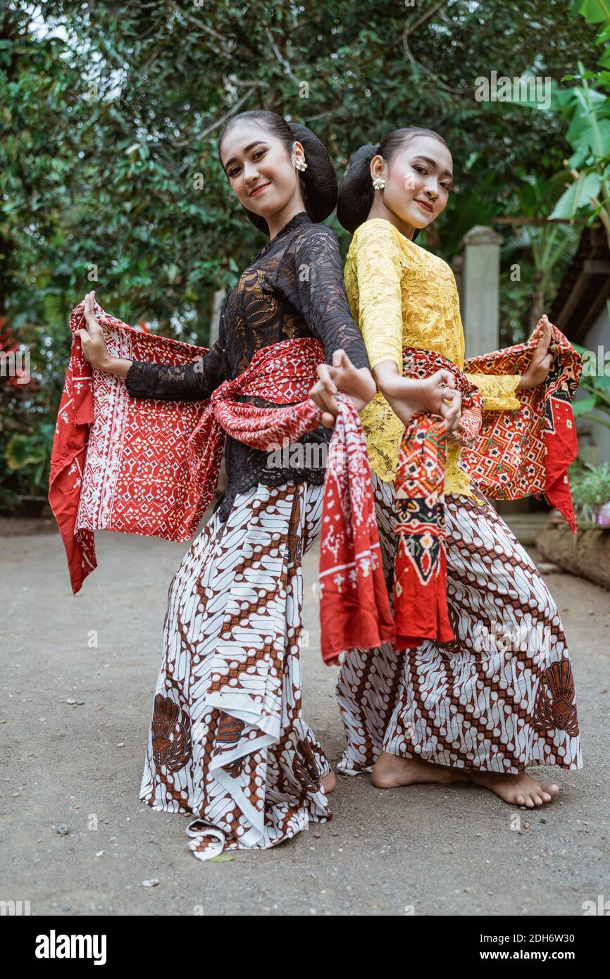 portrait young women presenting traditional Javanese dance movements ...