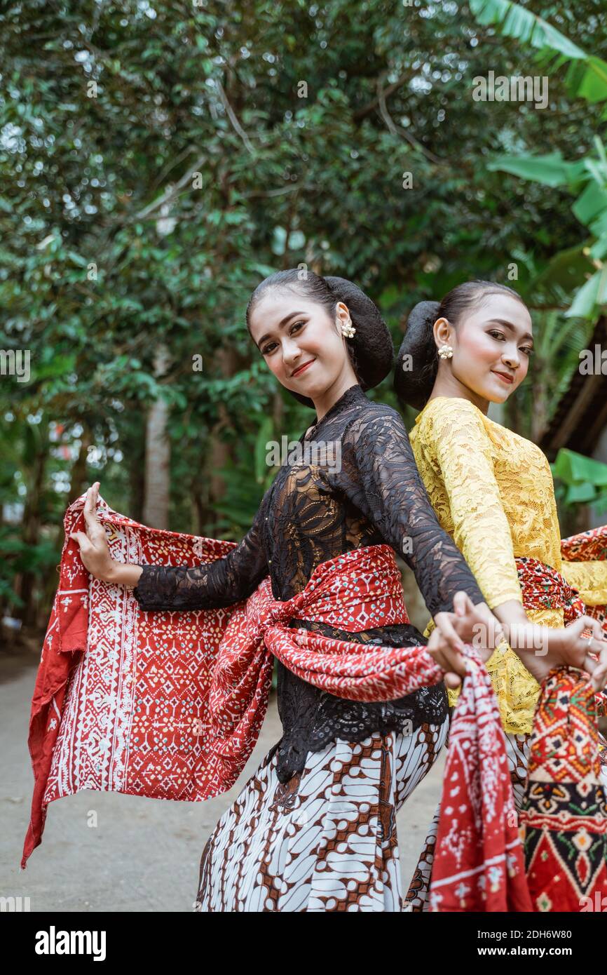 portrait young women presenting traditional Javanese dance movements ...