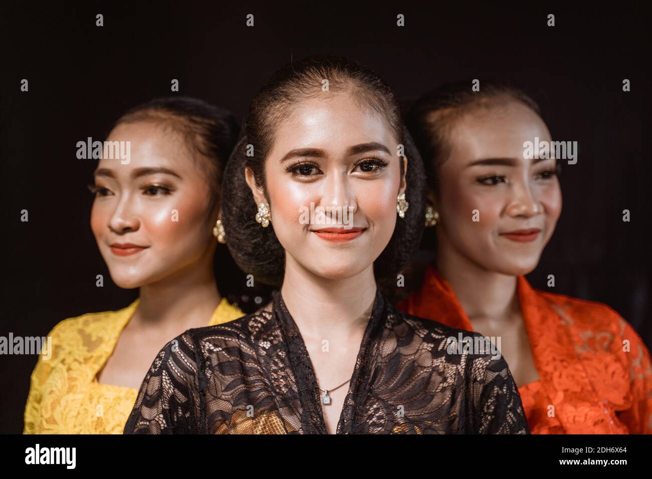 a group portrait of young woman wearing Javanese kebaya traditional ...