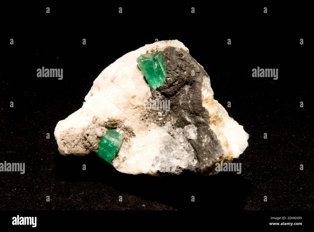 rough unrefined green gemstone emeralds samples in quartz Stock Photo ...