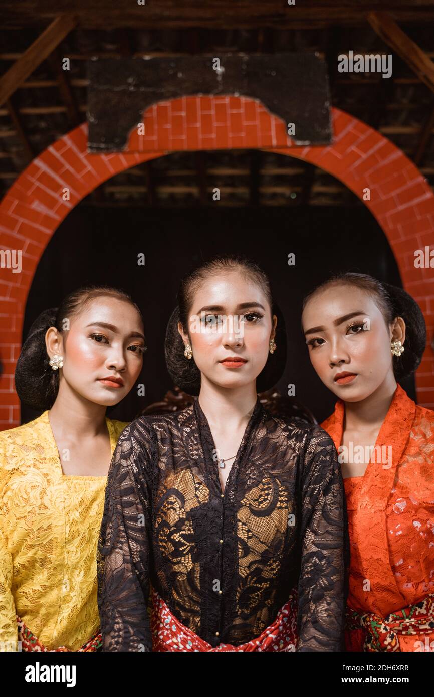 portrait of a young woman wearing Javanese kebaya traditional clothes ...