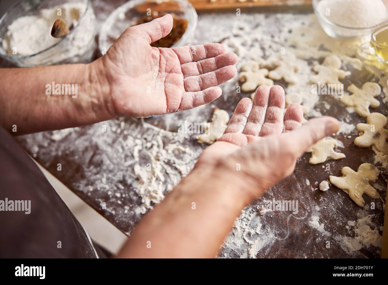 Hands of experienced baker being covered in flour Stock Photo - Alamy