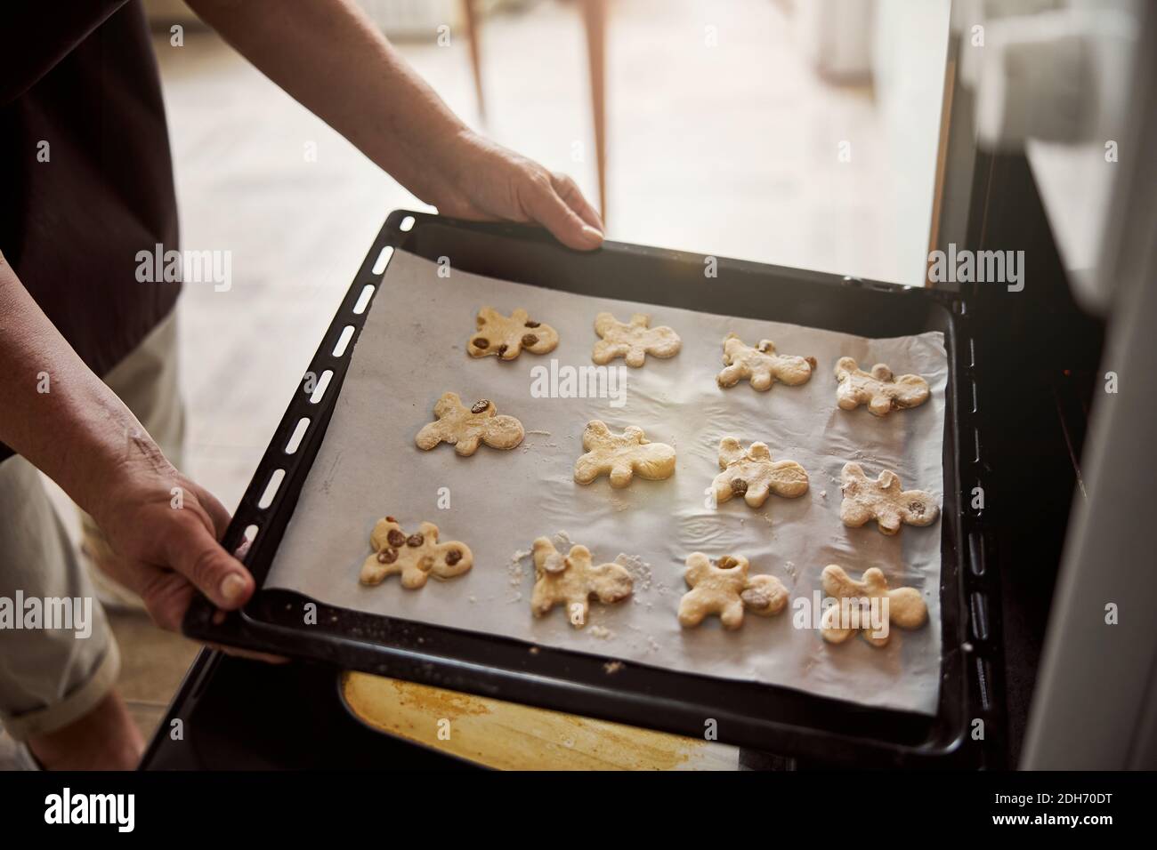 Whole sheet of man-shaped cookies about to baked Stock Photo - Alamy