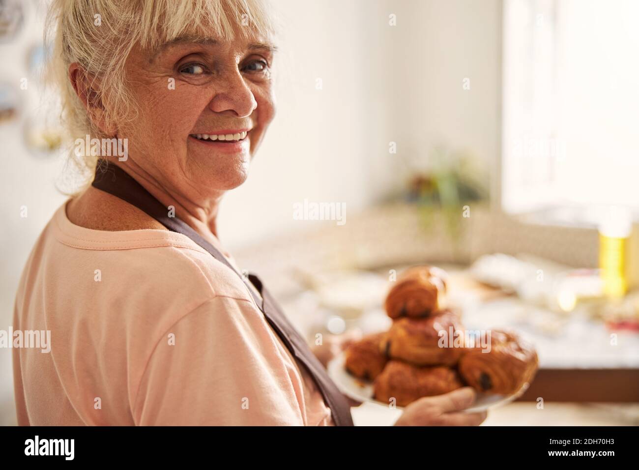 Grandma posing with her special home-baked goods Stock Photo - Alamy