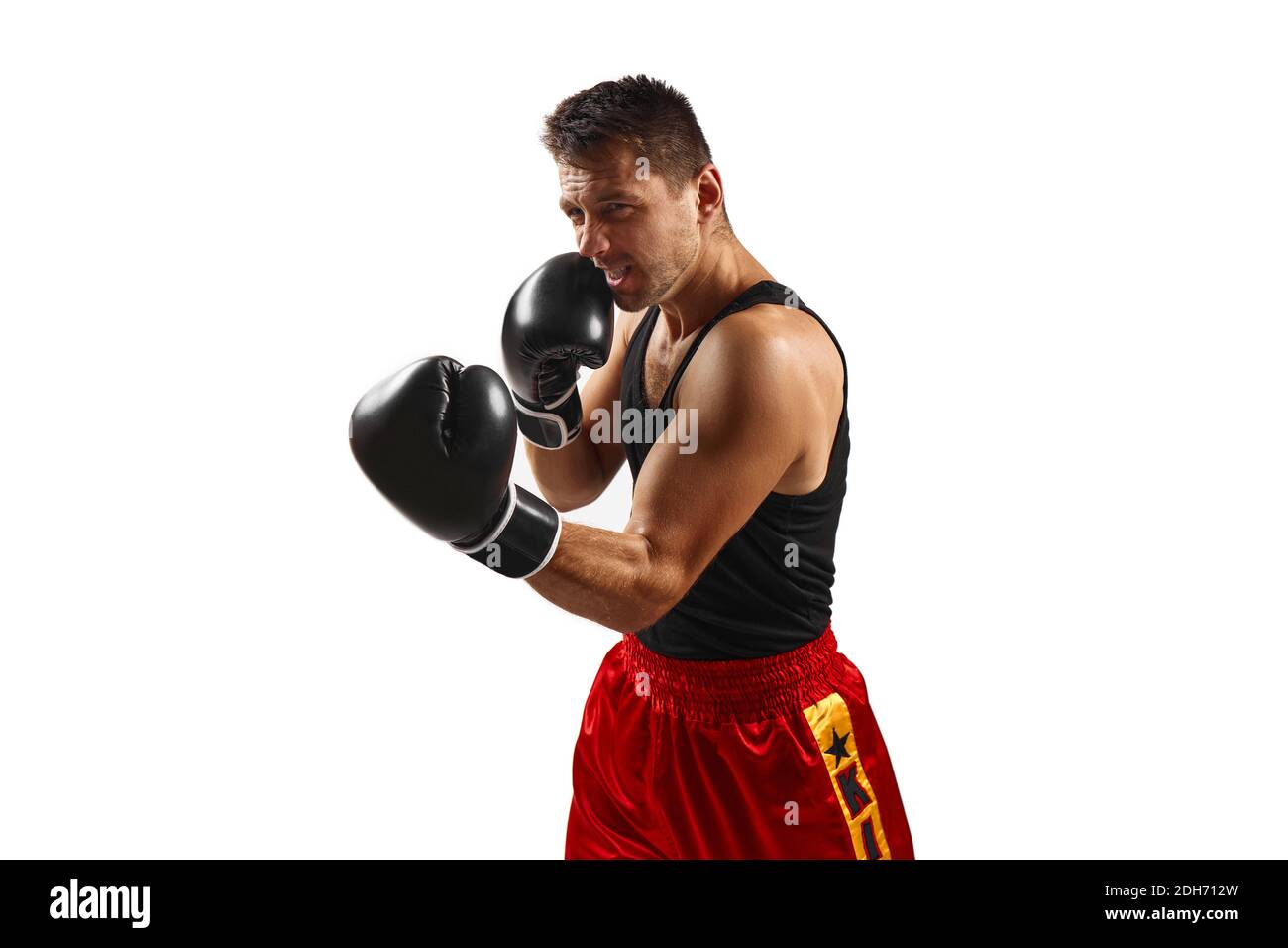 professional boxer man in black boxing gloves punching isolated on ...