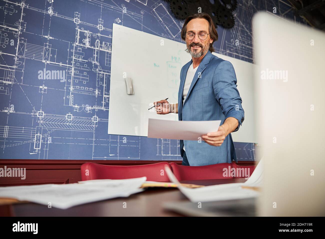 Intelligent professor leading a class and explaining stuff Stock Photo ...