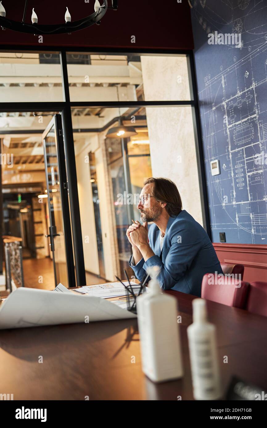 Concentrated gentleman thinking of the project for his work Stock Photo ...