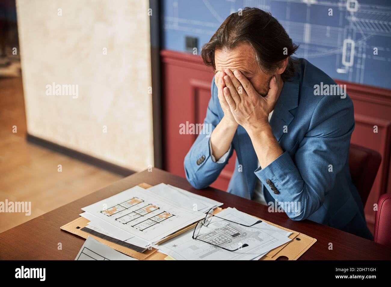 Busy office worker suffering from burnout while doing his job Stock ...