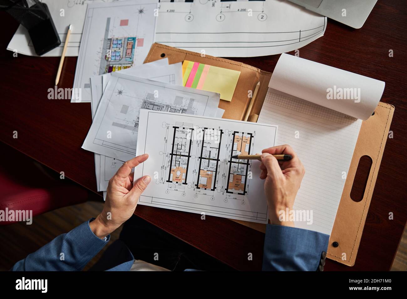 Office worker checking important documents at the desk Stock Photo - Alamy