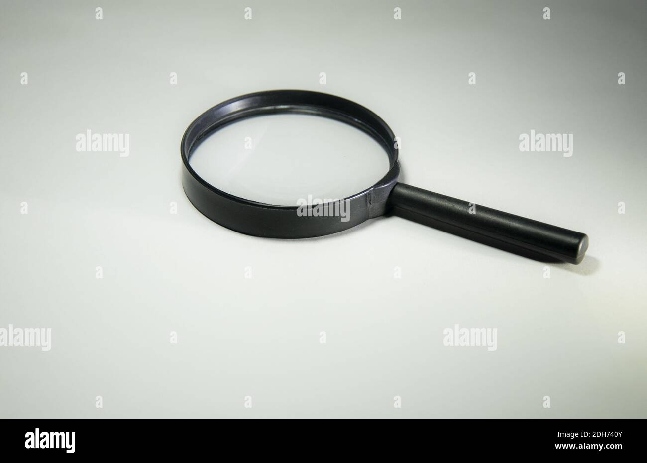 A closeup picture of a loop on an isolated background. Glass loop with ...