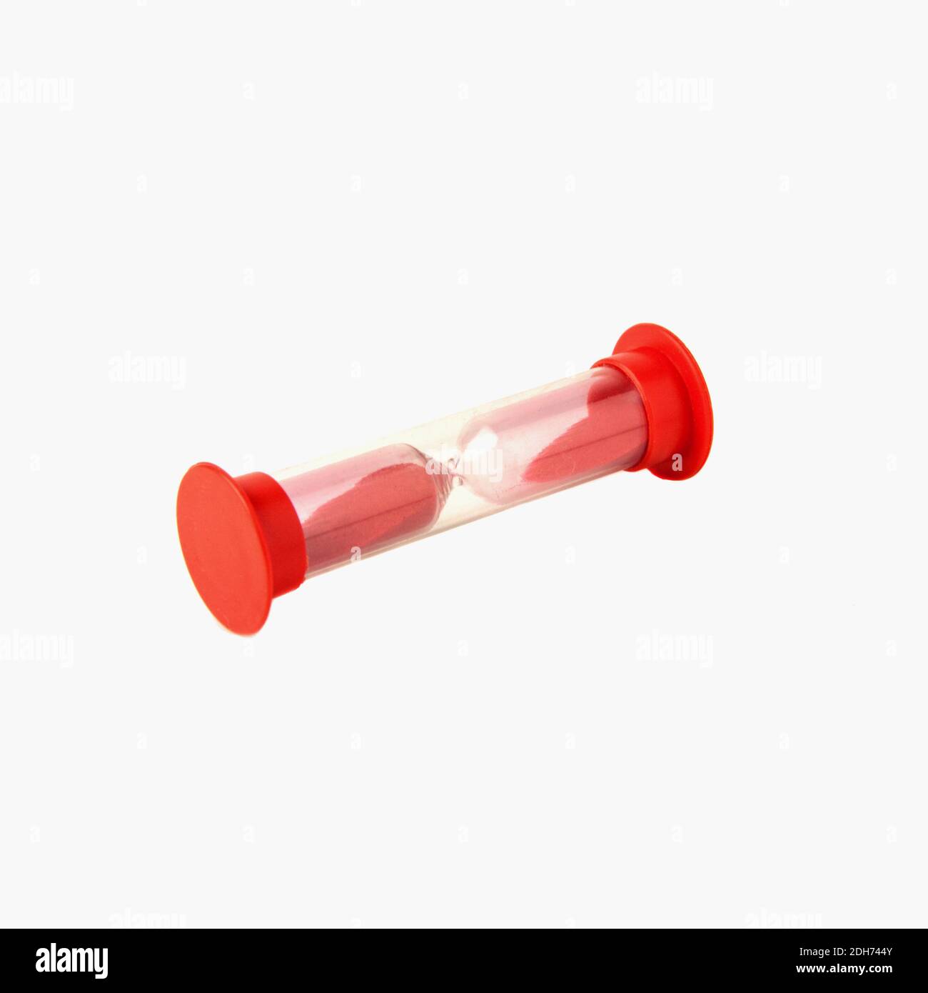 Hourglass of glass and red plastic isolated on white background Stock ...