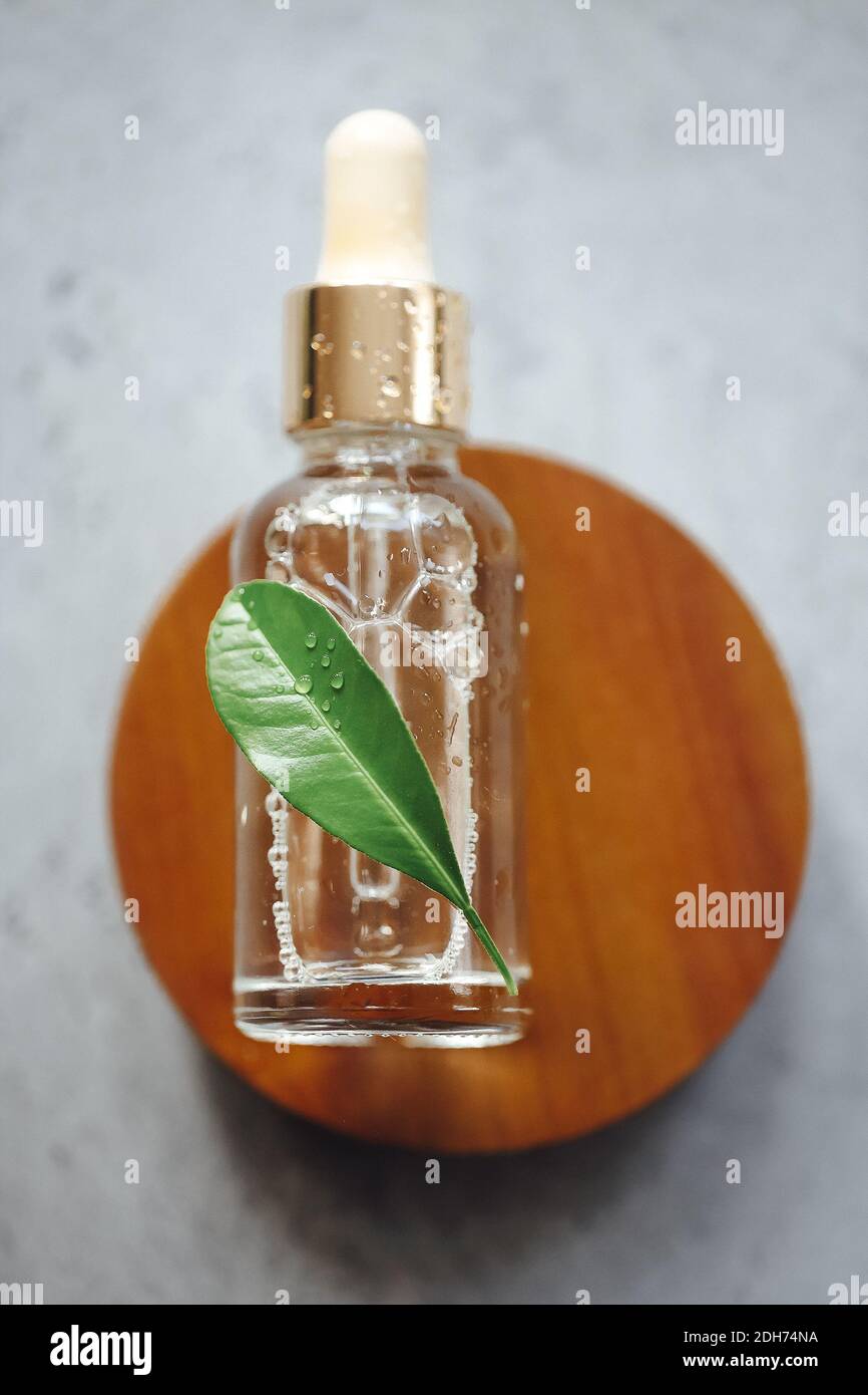 Essential oil with green leaf Stock Photo - Alamy