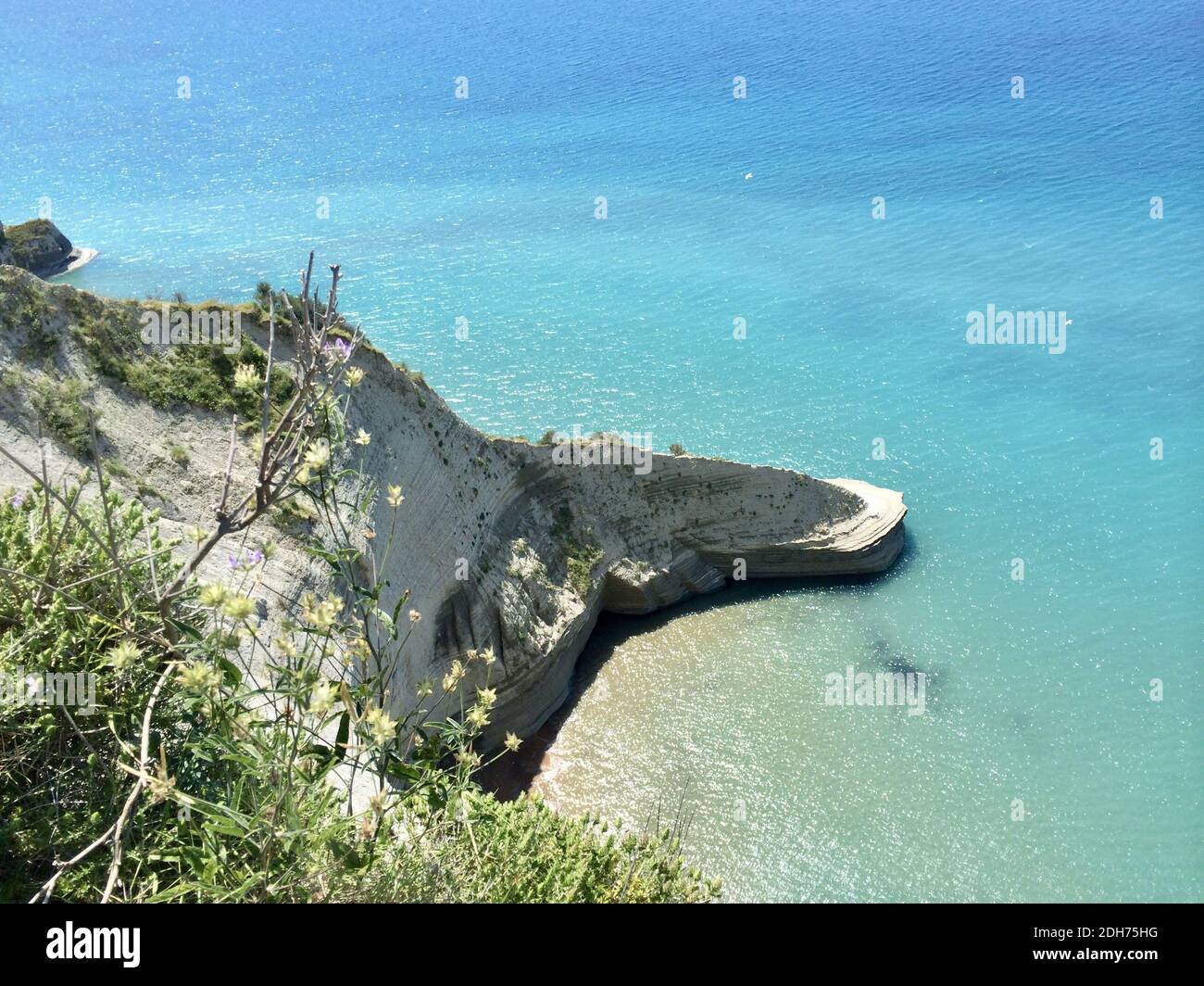 A beautiful view of the light multicolor ocean from the cliff with the ...