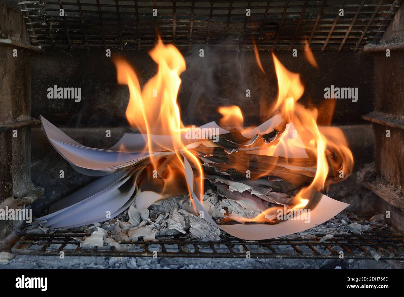 Burning paper documents. Flames and scorched paper. Good example of ...