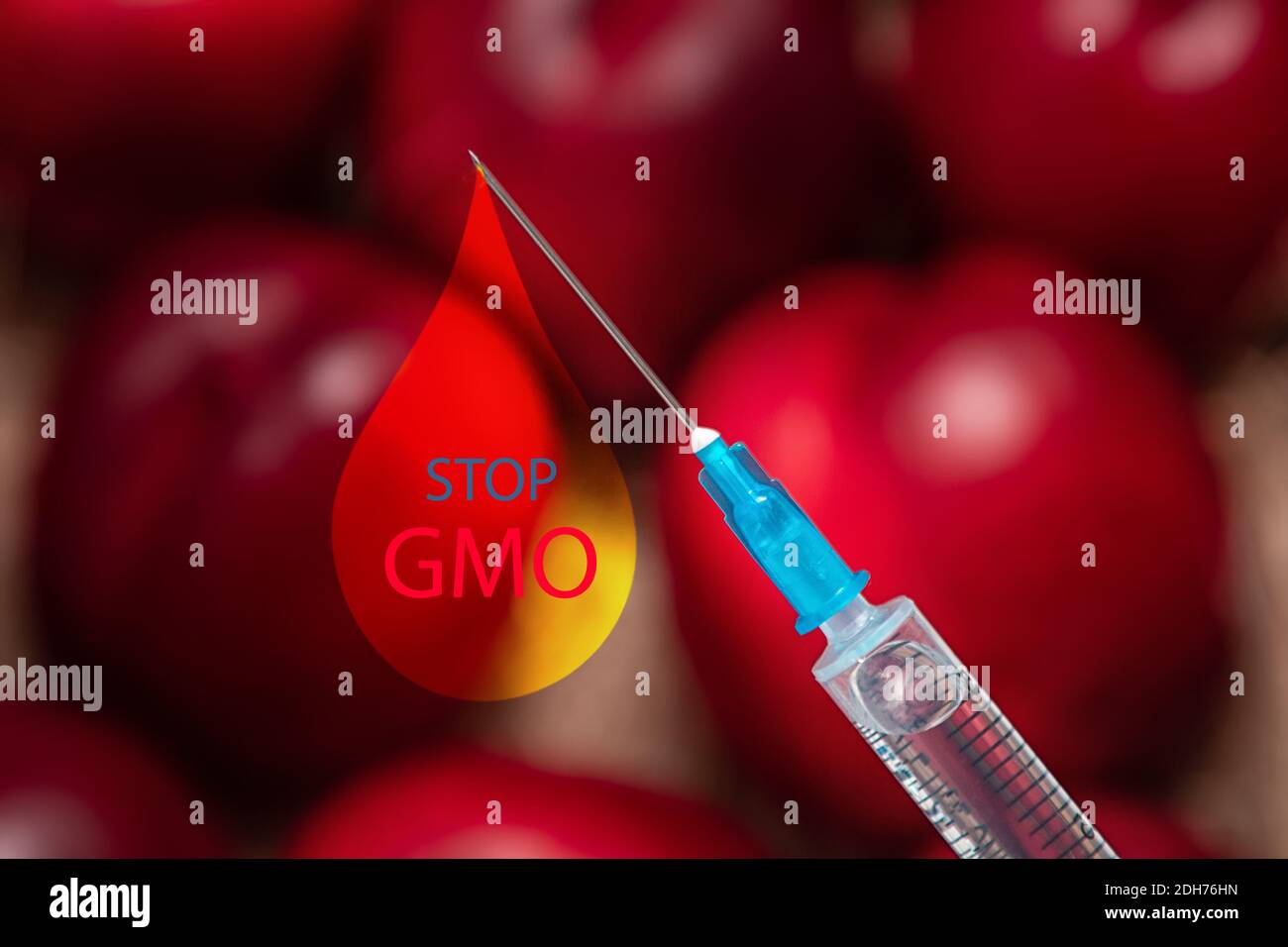 Syringe with chemical injection close-up. Blurred peaches in the ...