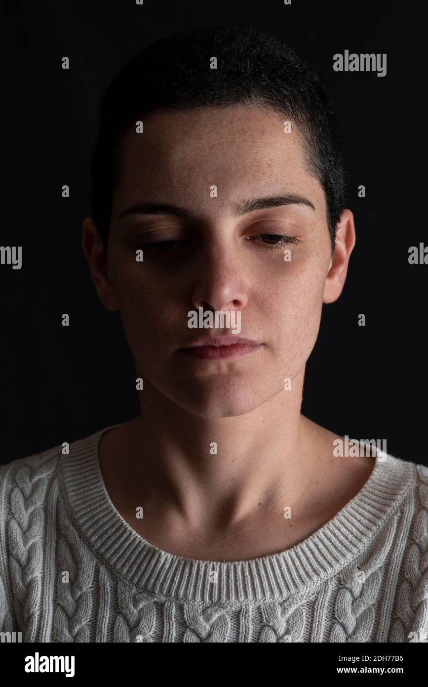 Sad beautiful woman looking down Stock Photo - Alamy