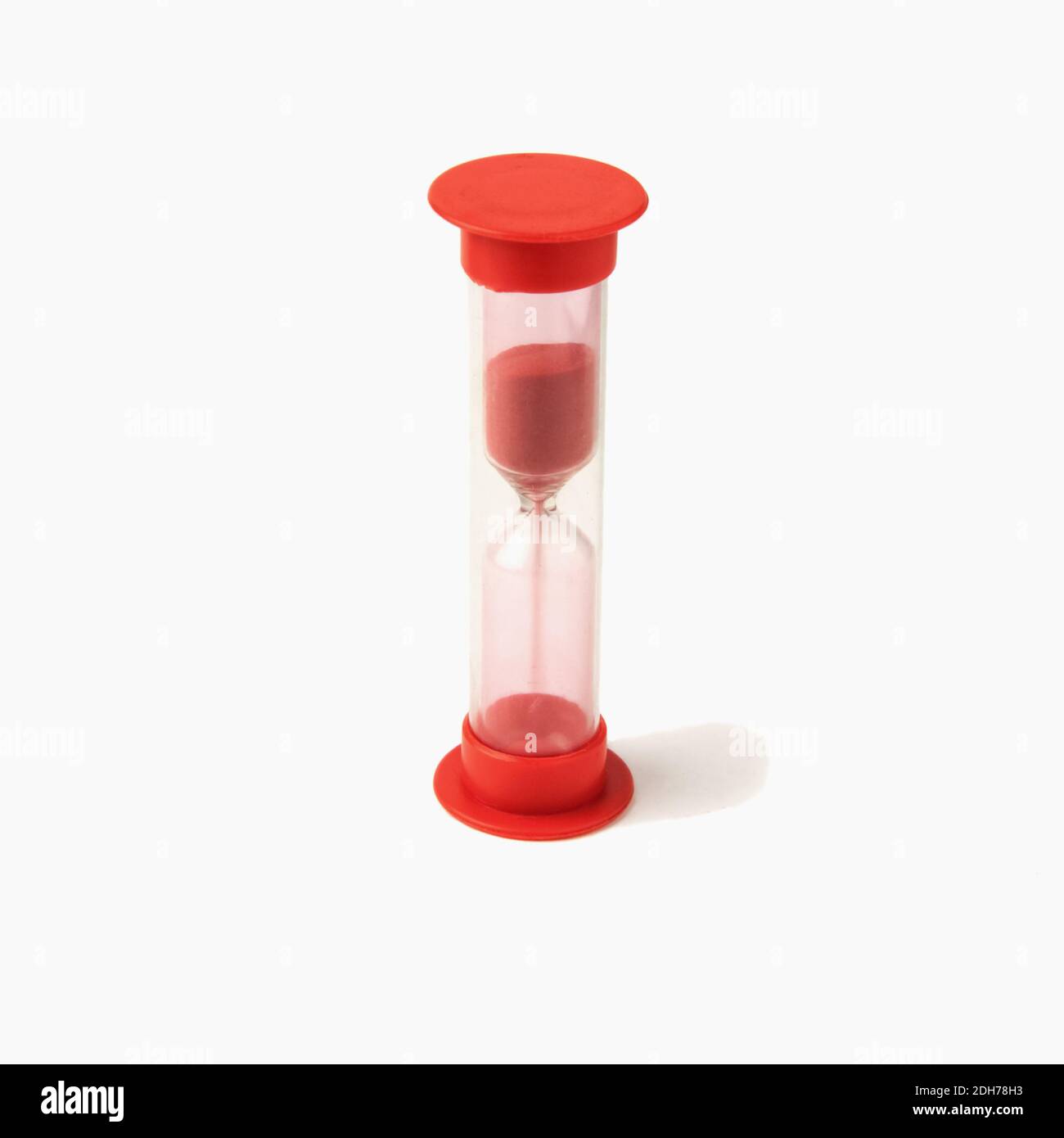 Red plastic hourglass isolated on white background. Concept of time ...