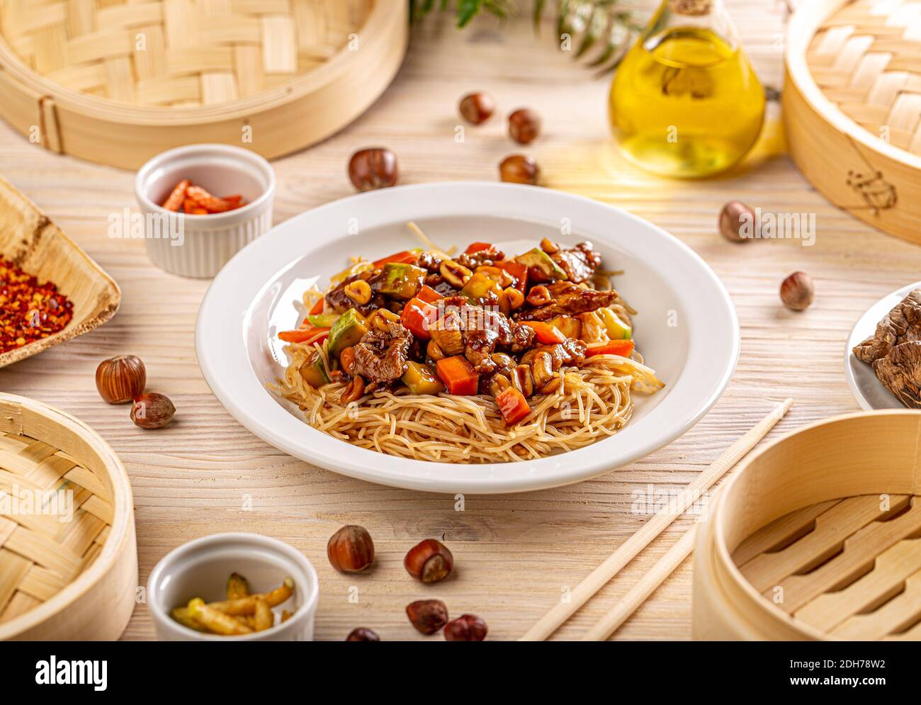 Stir-fried noodles dish with pork and vegetables. Traditional Chinese ...