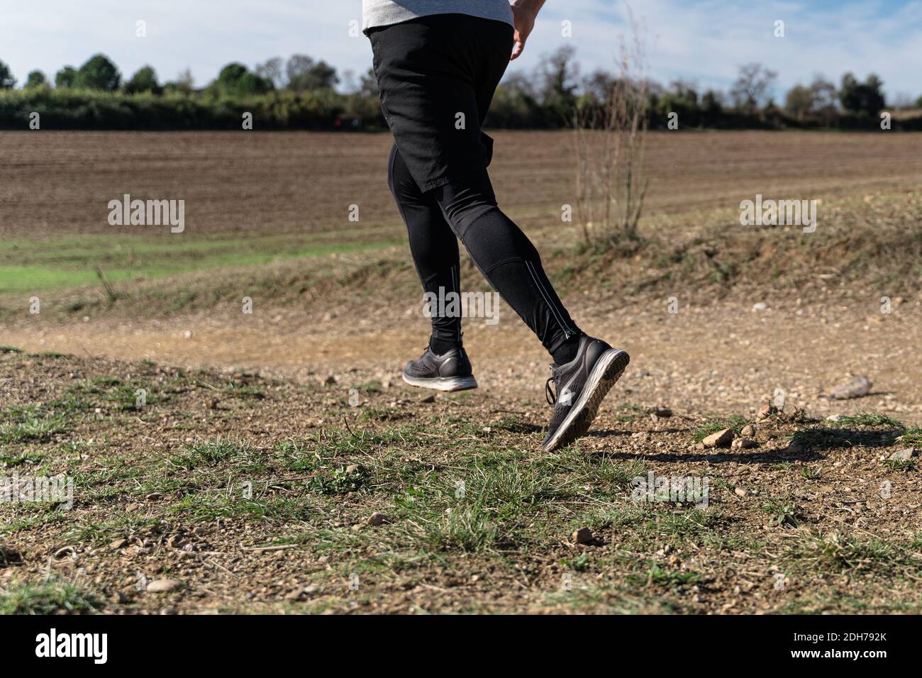 An athlete running and working out on a warm and sunny day Stock Photo ...