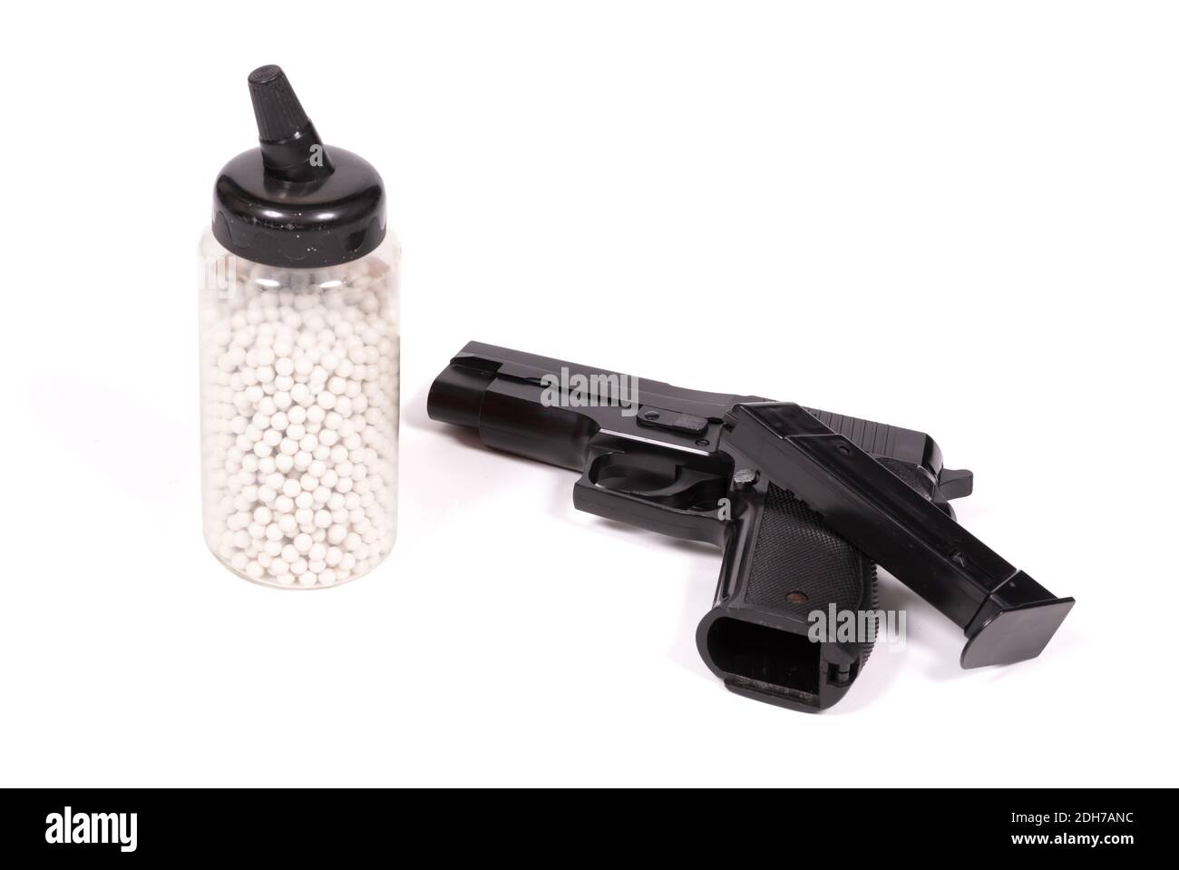 Airsoft pistol with bb bullets on light background Stock Photo - Alamy