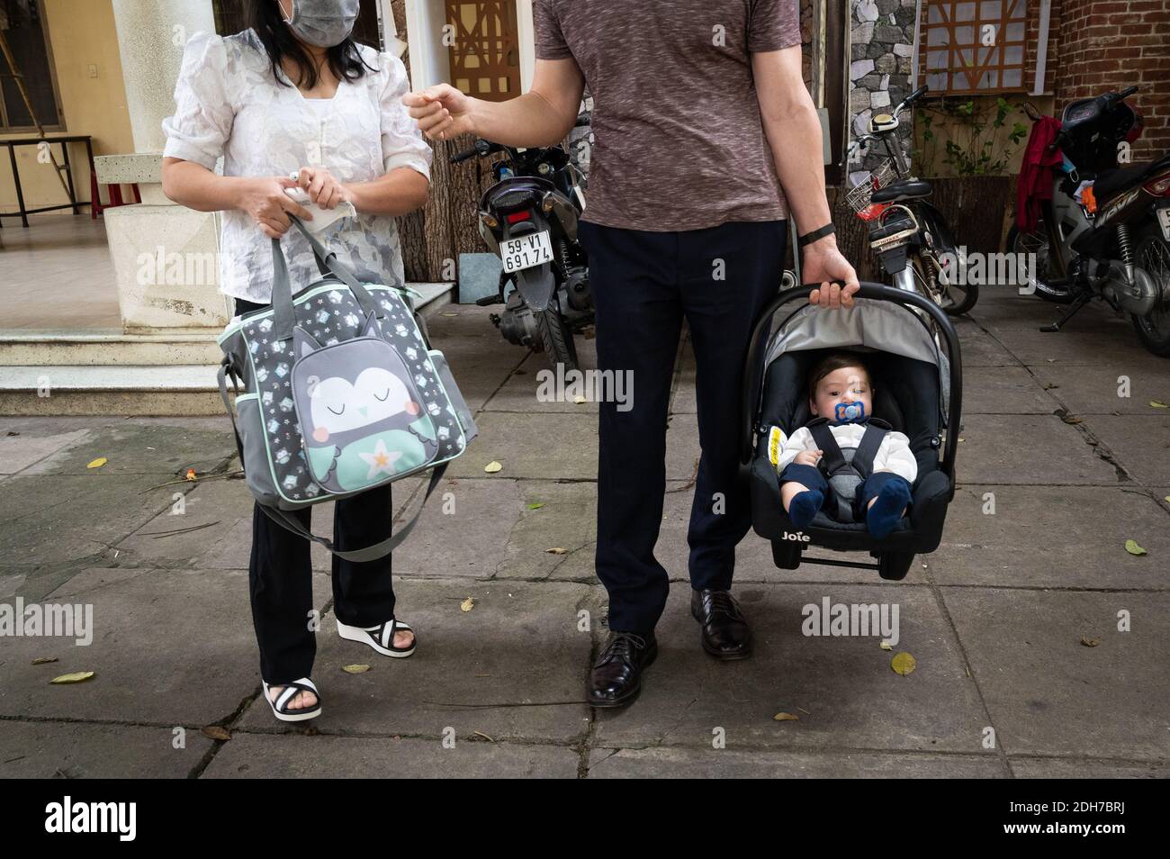 Portrait of a Eurasian Vietnamese baby boy and his parents, Ho Chi Minh ...