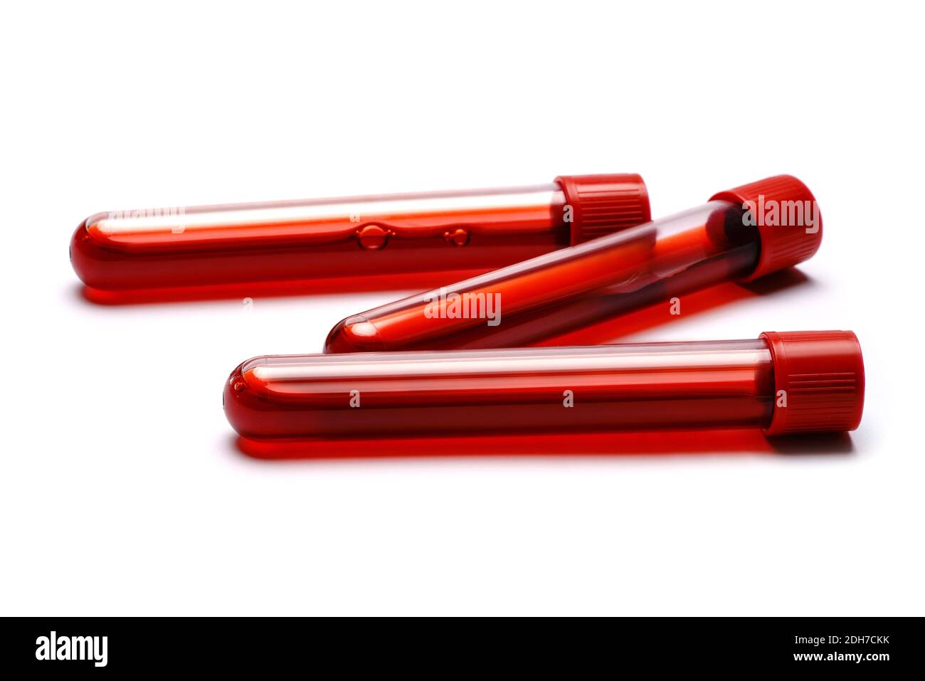 Test tube with red plug isolated on white background Stock Photo - Alamy