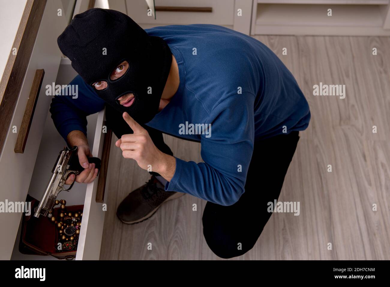 Camera view of male robber stealing things Stock Photo - Alamy